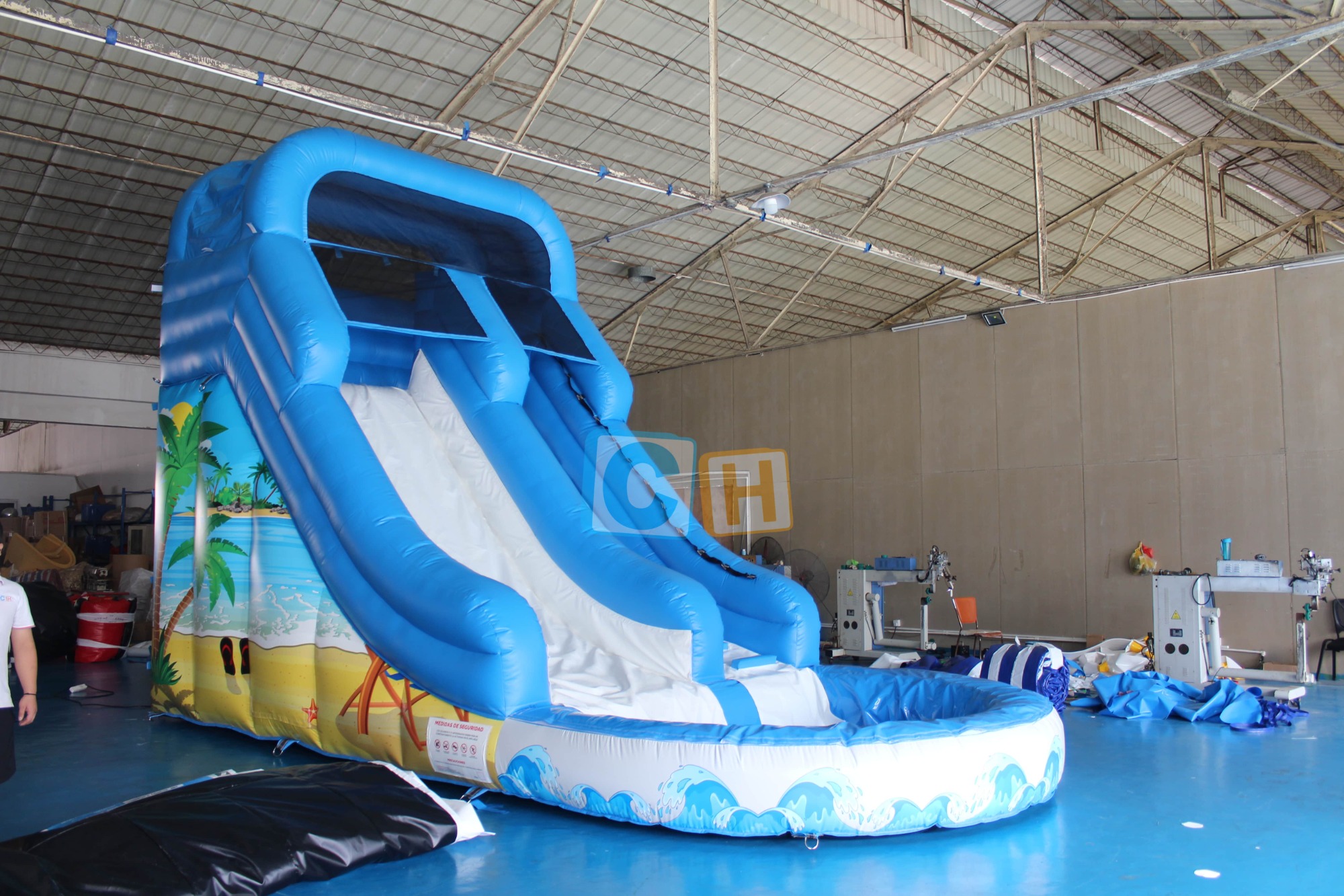 Inflatable swimming pool with slide
