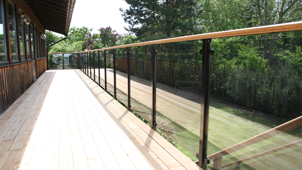 glass railing with black steel baluster for balcony design