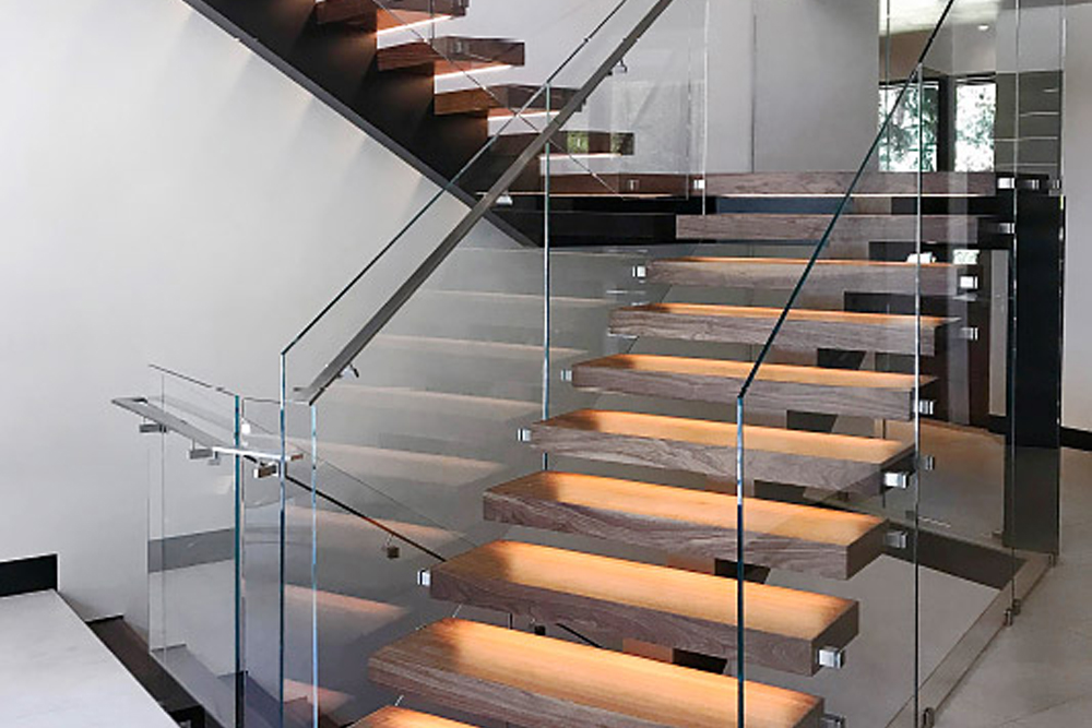 mono beam staircase with glass railing and led strip light