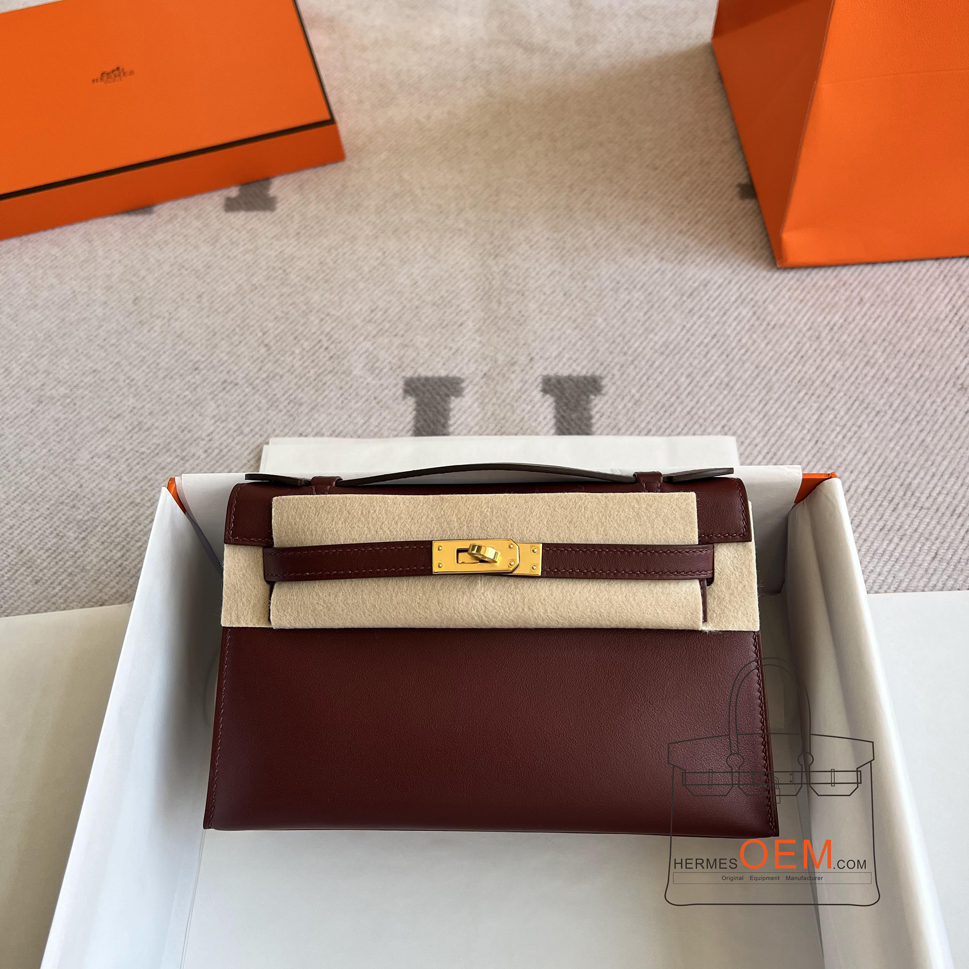 Kelly pochette CK55 Rouge H Swift GHW