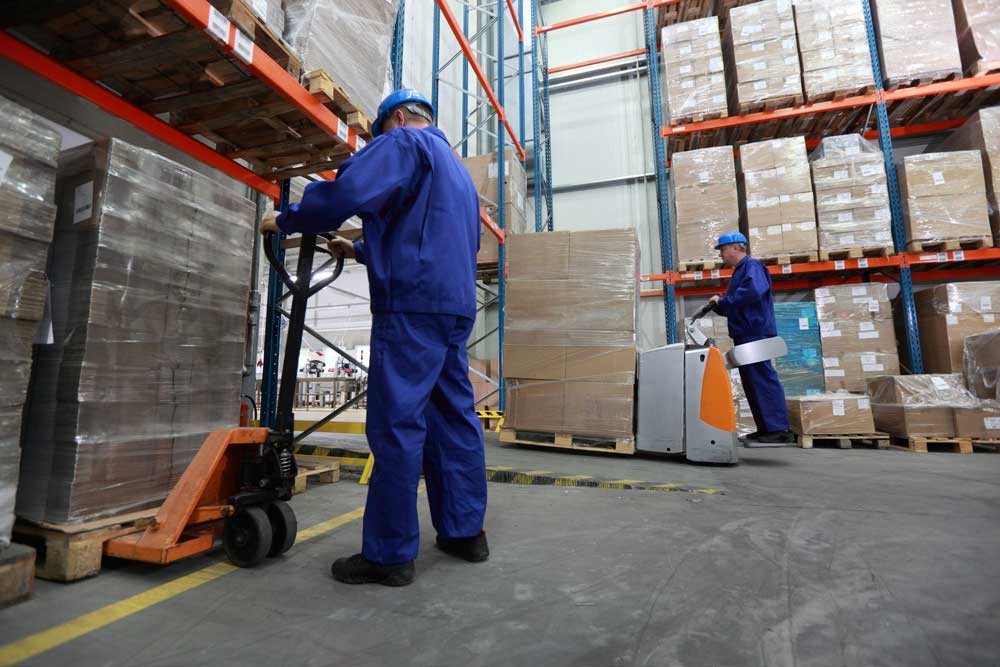 What is palletization and some of its benefits in warehouse storage?