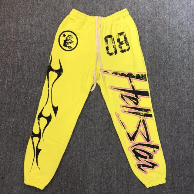 Hellstar studios letters sweat pants yellow black green