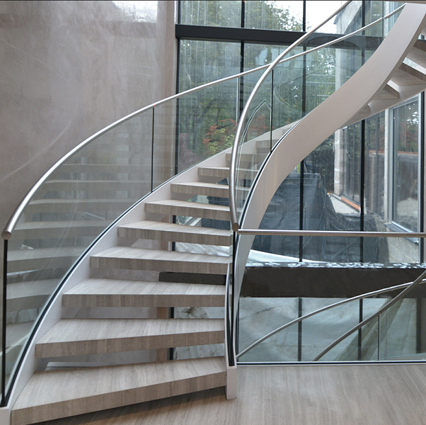 Curved staircase with glass balustrade and American red oak treads ...