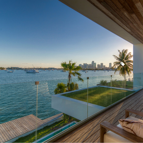 Frameless modern glass railing with u channel base fixings