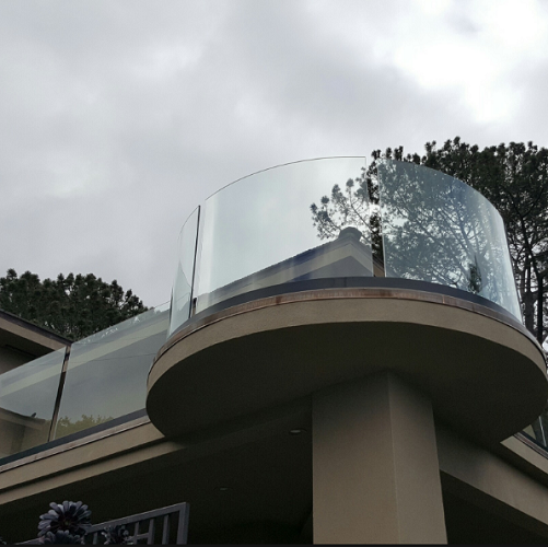 Frameless modern glass railing with u channel base fixings