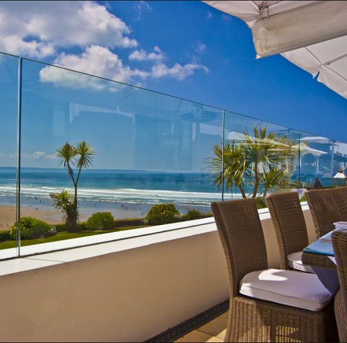 Frameless modern glass railing with u channel base fixings