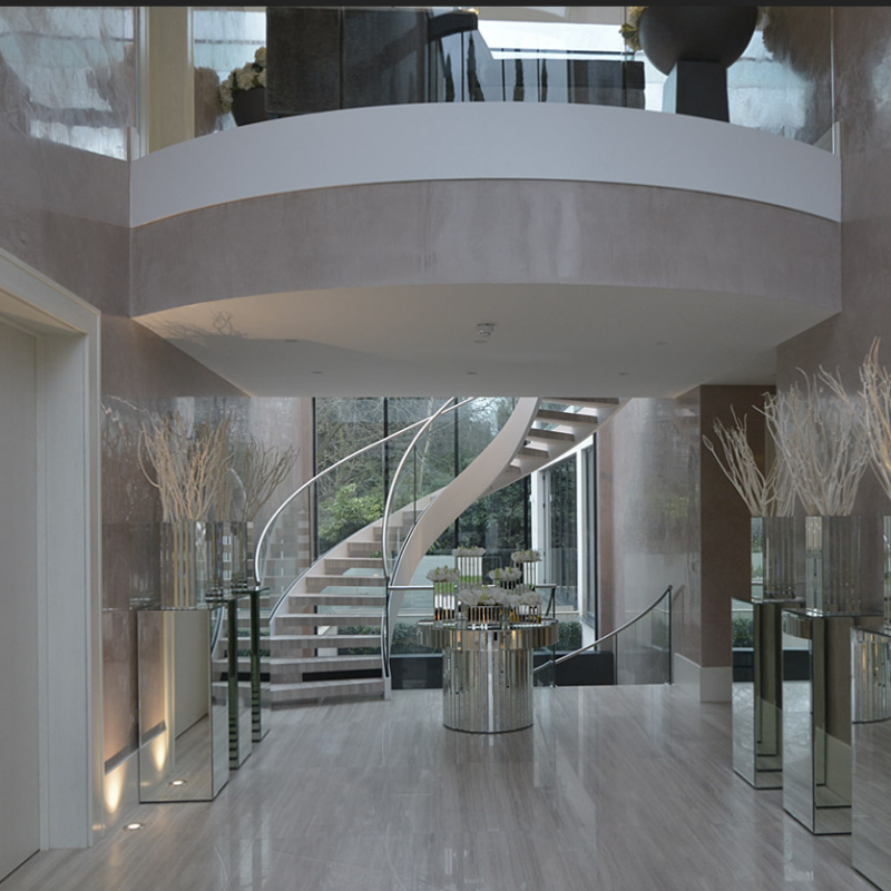 Curved staircase with glass balustrade and American red oak treads ...