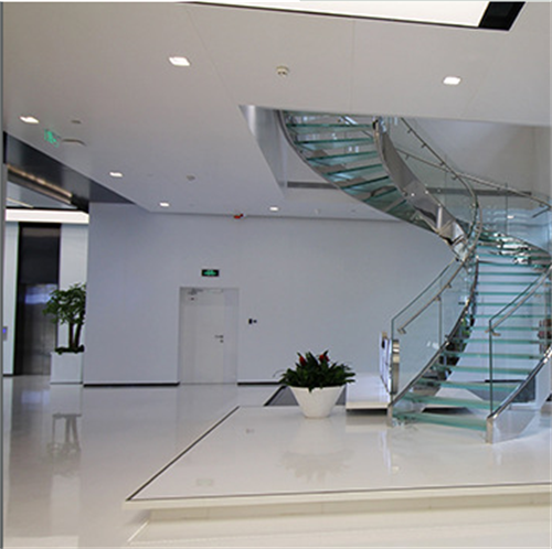 Fancy curved staircase design with glass steps