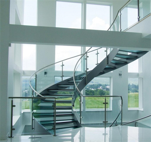 Fancy curved staircase design with glass steps