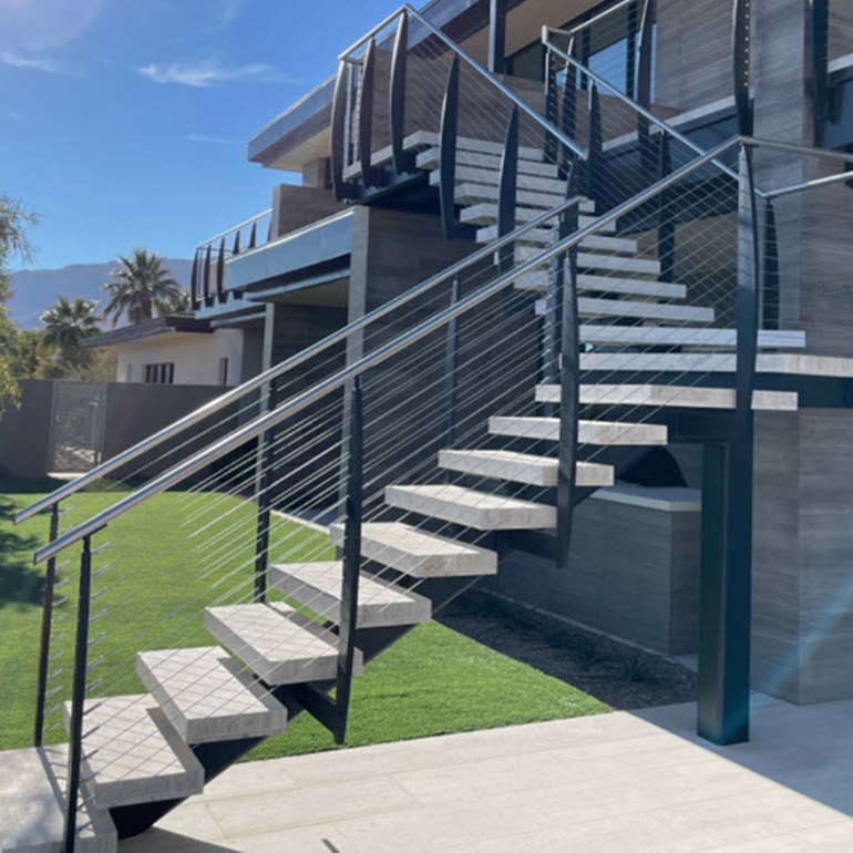 Exterior mono stringer staircase with wood tread and cable railing