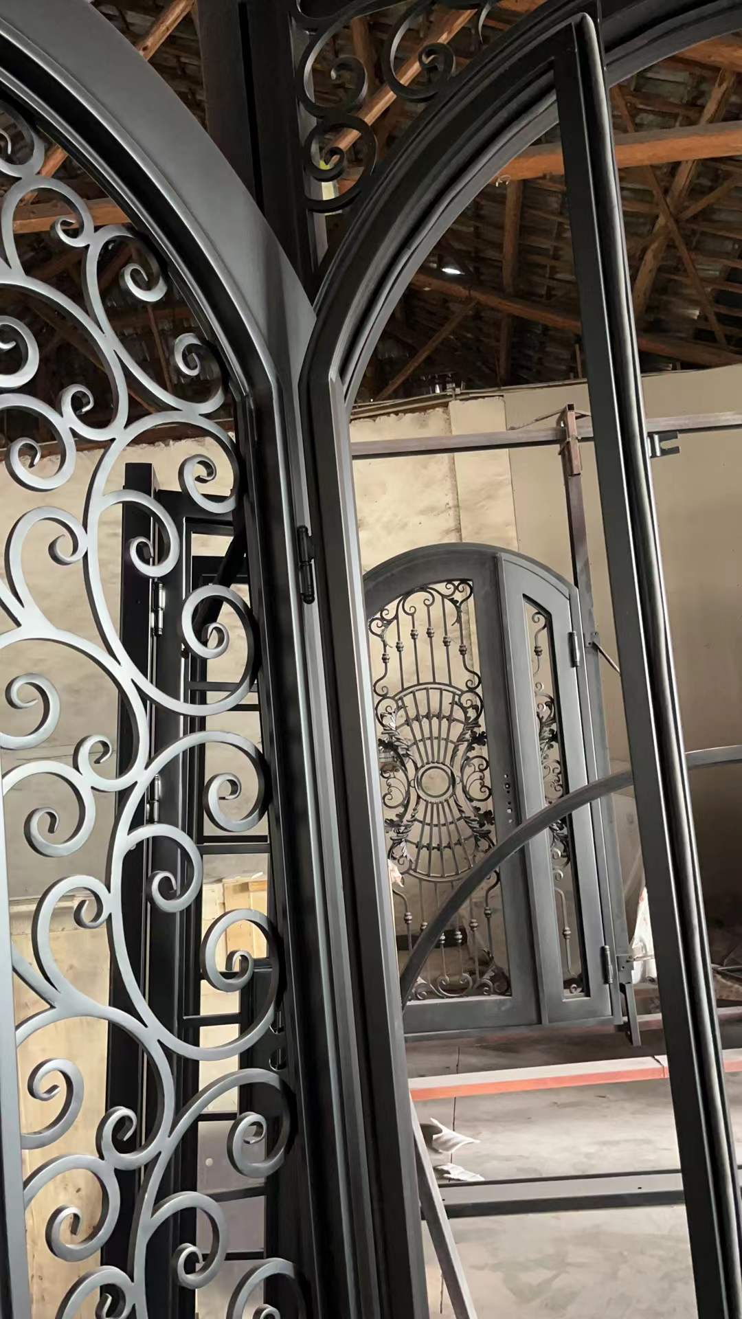 Double panel wrought iron front entry door with arc top in brown color ...