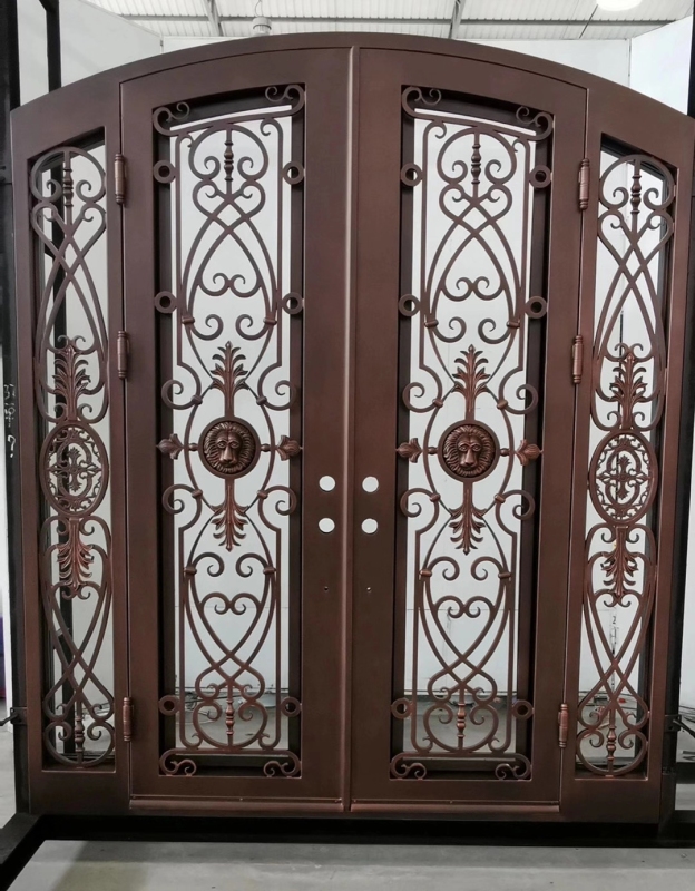 Double panel wrought iron front entry door with arc top in brown color ...