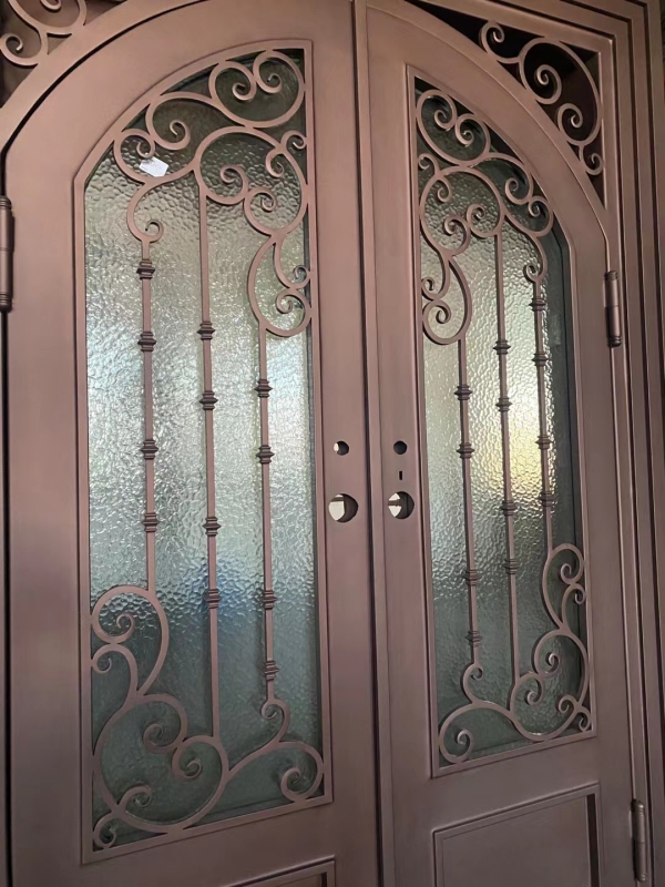 Double panel wrought iron front entry door with arc top in brown color ...
