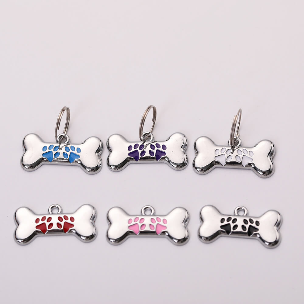 Metal dog tags with footprints, bone pendants and engraved tags