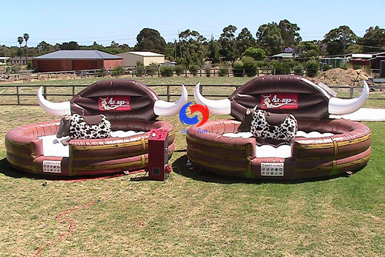 two players PK bucking bull ride twin mechanical bull with one ...